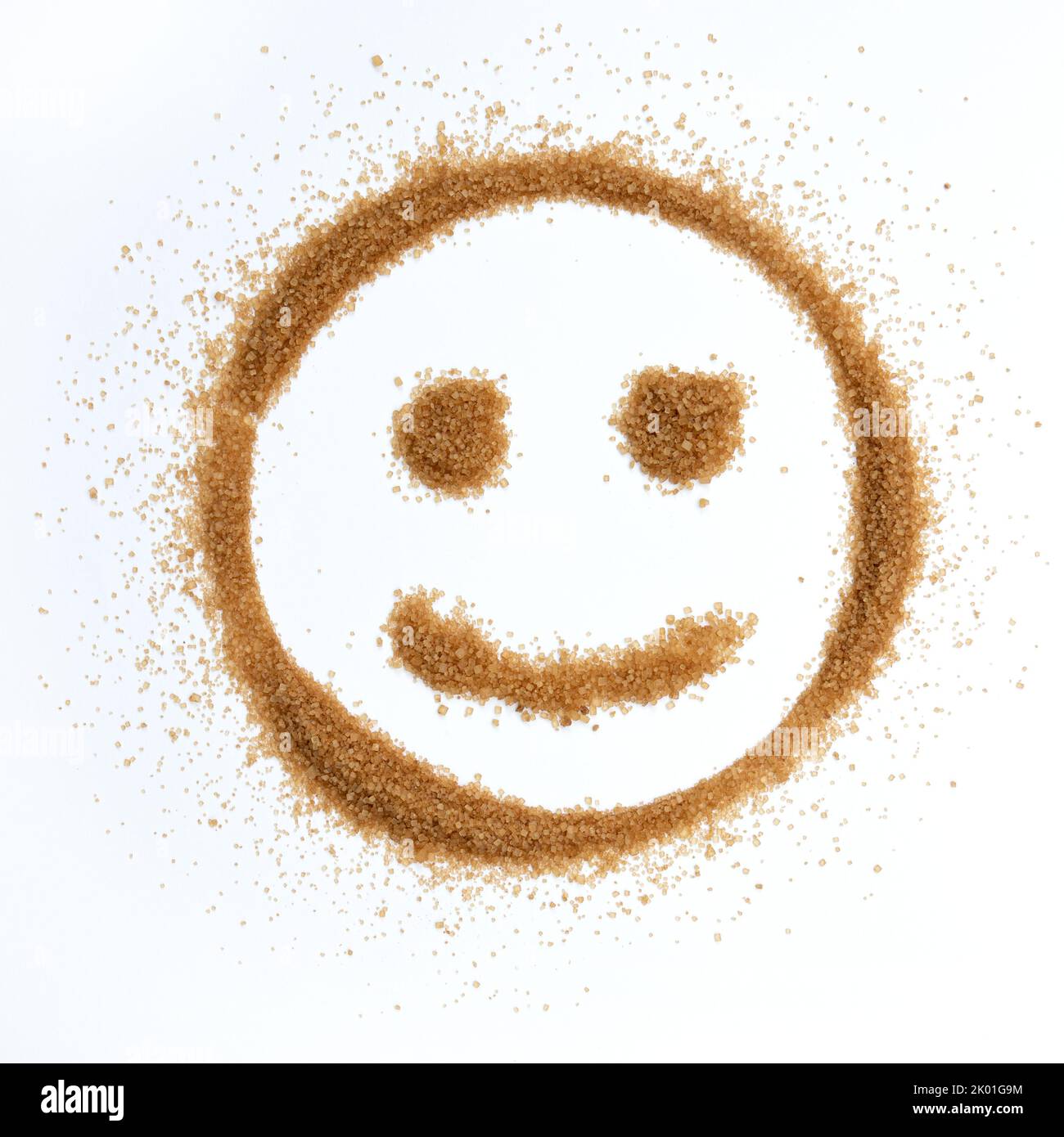 top view of unrefined natural brown sugar is laid out in form of smiley ...