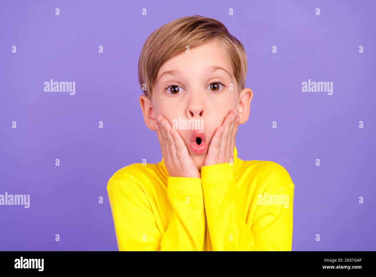 Portrait of impressed stunned person arms touch cheeks pouted lips ...