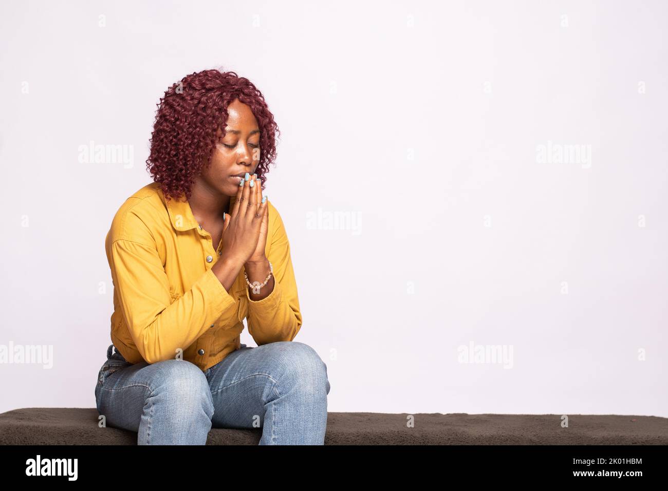 young african lady saying her prayers Stock Photo - Alamy
