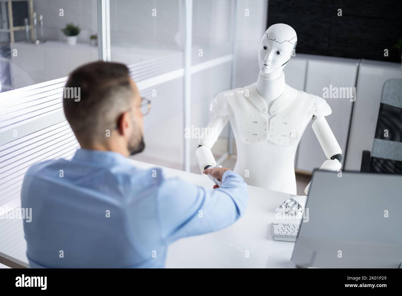 Men At Interview With AI Robot Machine Stock Photo - Alamy
