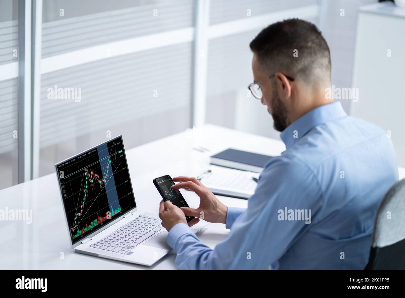 Stock Broker Exchange Trading App On Laptop And Phone Stock Photo - Alamy