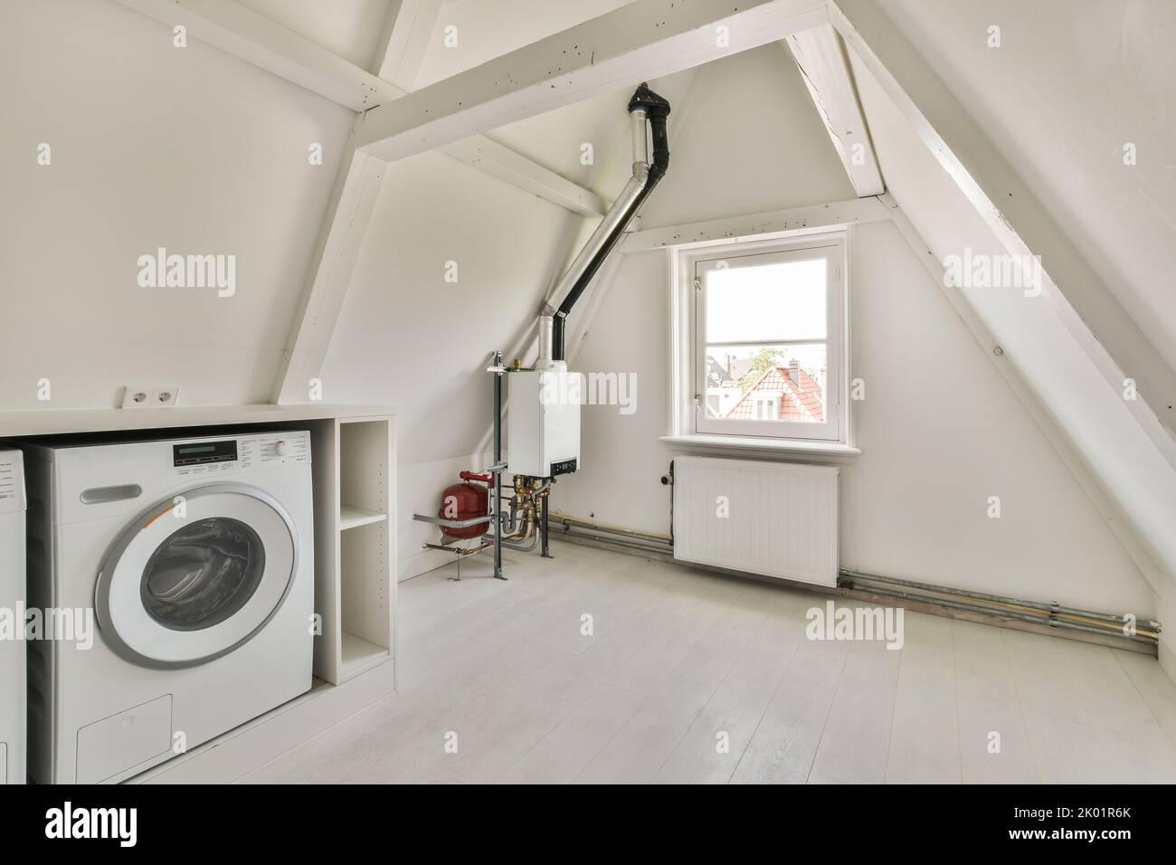 Engineering communications and laundy room in the mansard apartment ...