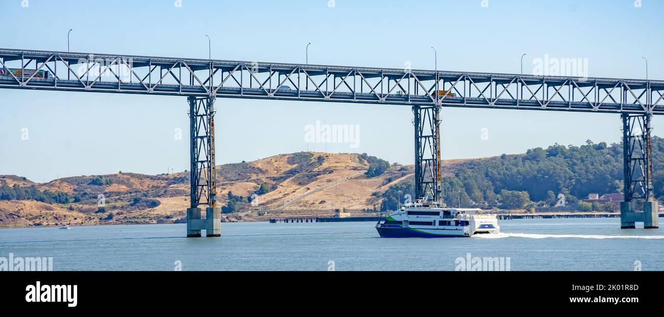 A San Francisco Bay Ferry sails underneath The Richmond Bridge in California, USA Stock Photo ...