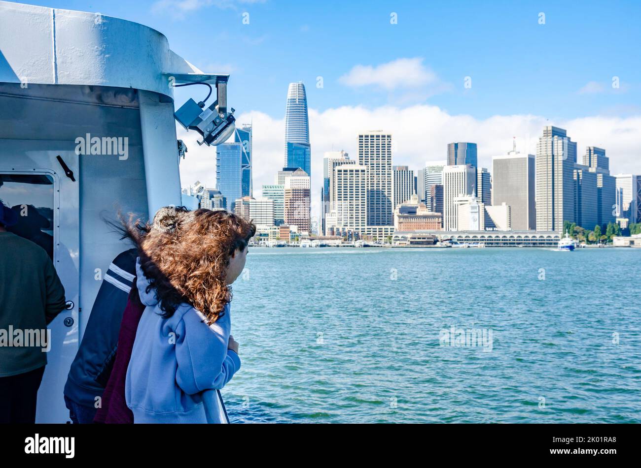Passengers on the top deck of a San Francisco Bay Ferry watching the ...