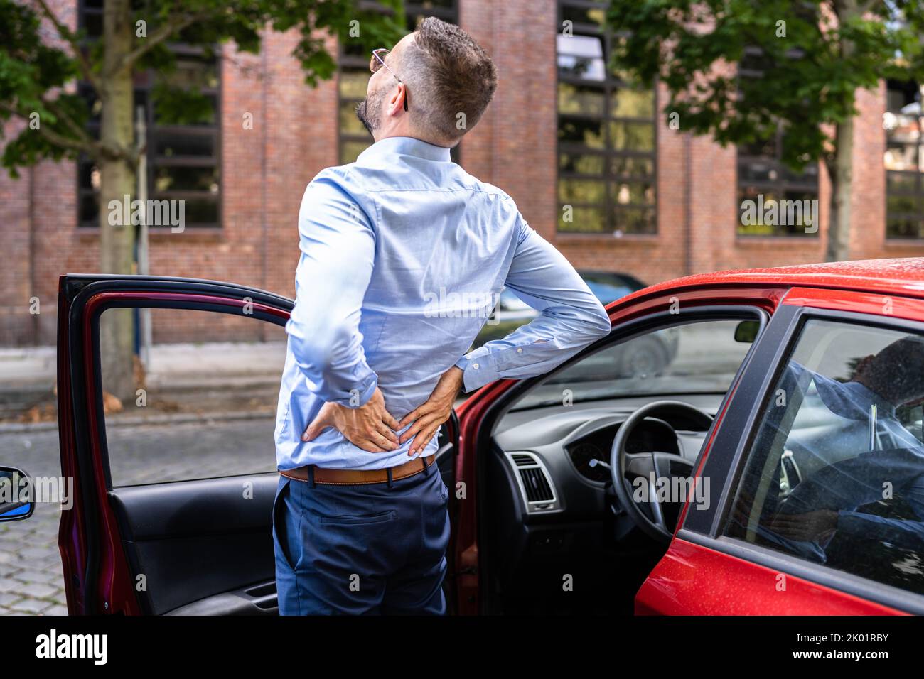 Back Pain Car Driving Injury And Tired Stock Photo - Alamy