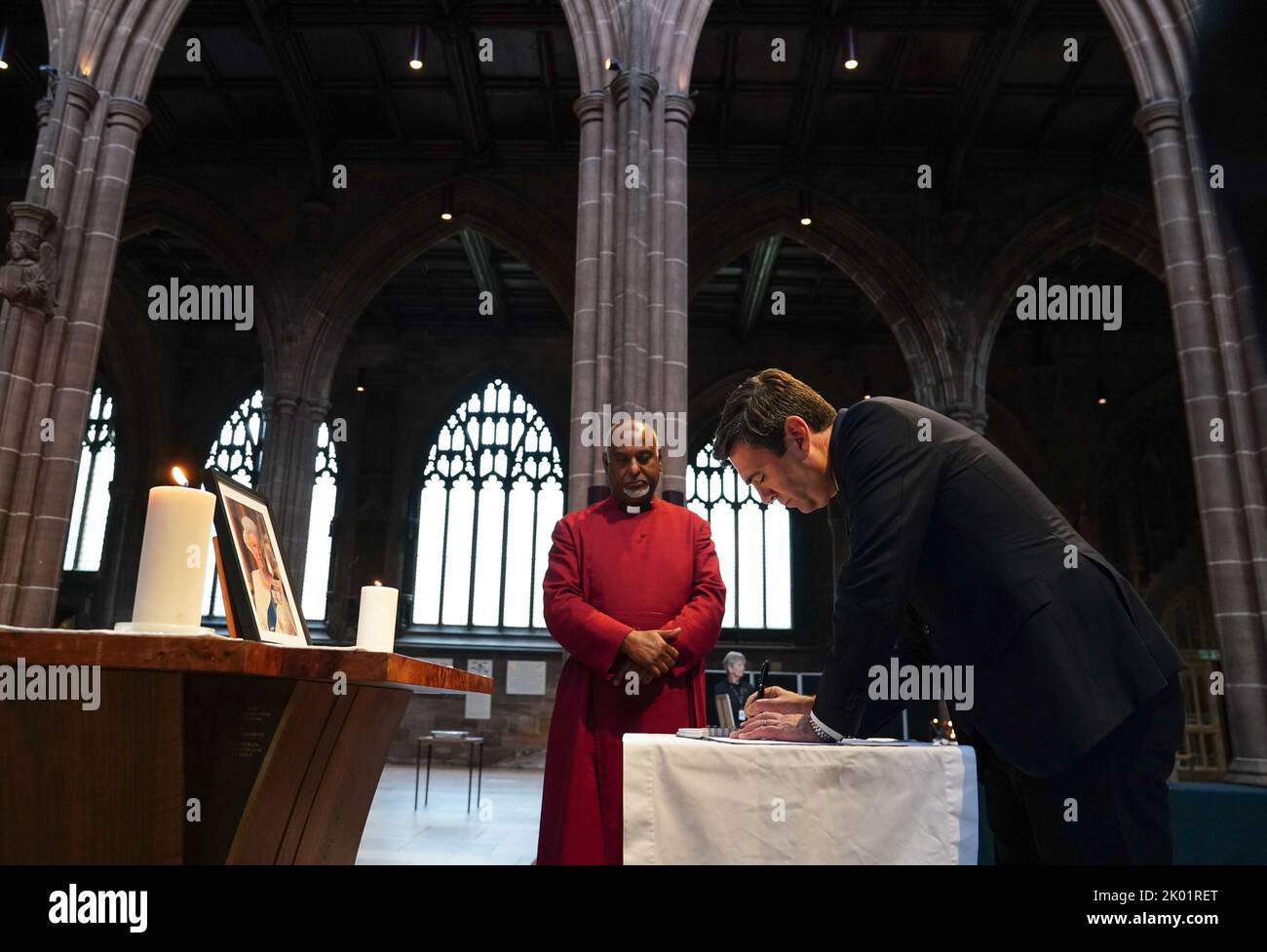Andy Burnham, Mayor of Greater Manchester, signing a book of condolence ...