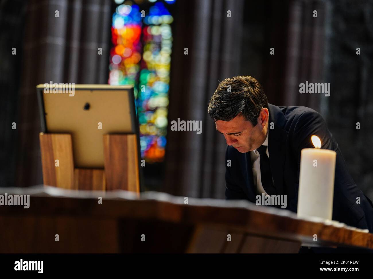 Andy Burnham, Mayor of Greater Manchester, signing a book of condolence ...