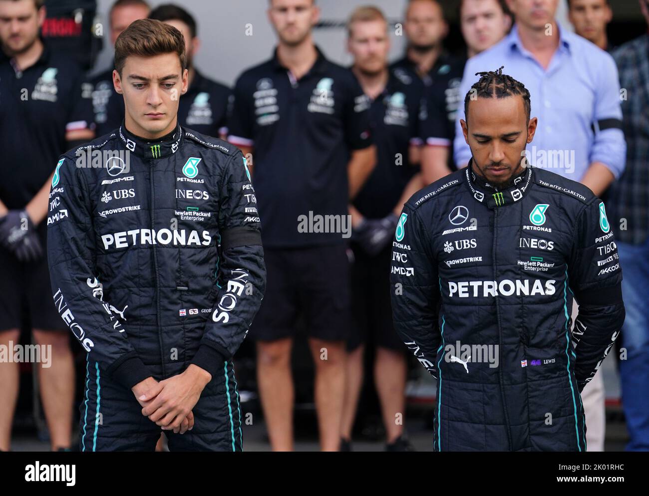 Mercedes' Lewis Hamilton (right) and George Russell stand during a ...