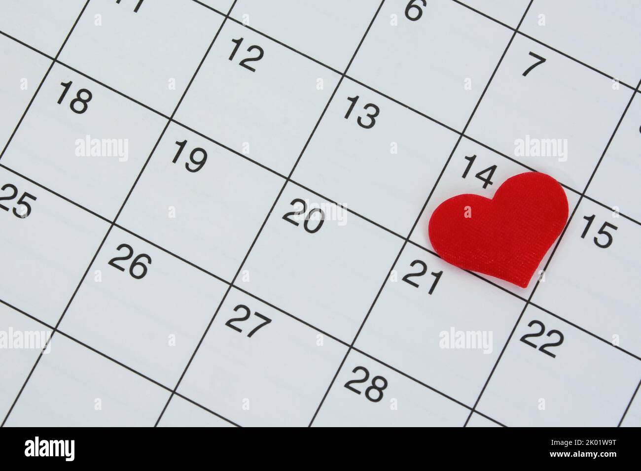 Red heart shape on the date of the 14th day in the calendar Stock Photo ...