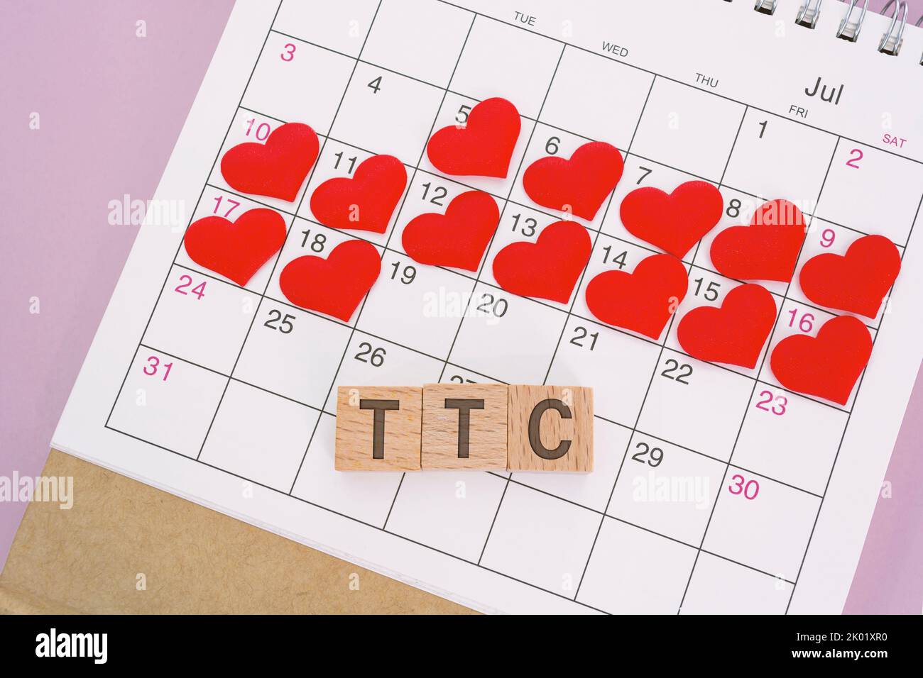 TCC word on wooden block with red heart shape on calendar. Surviving ...