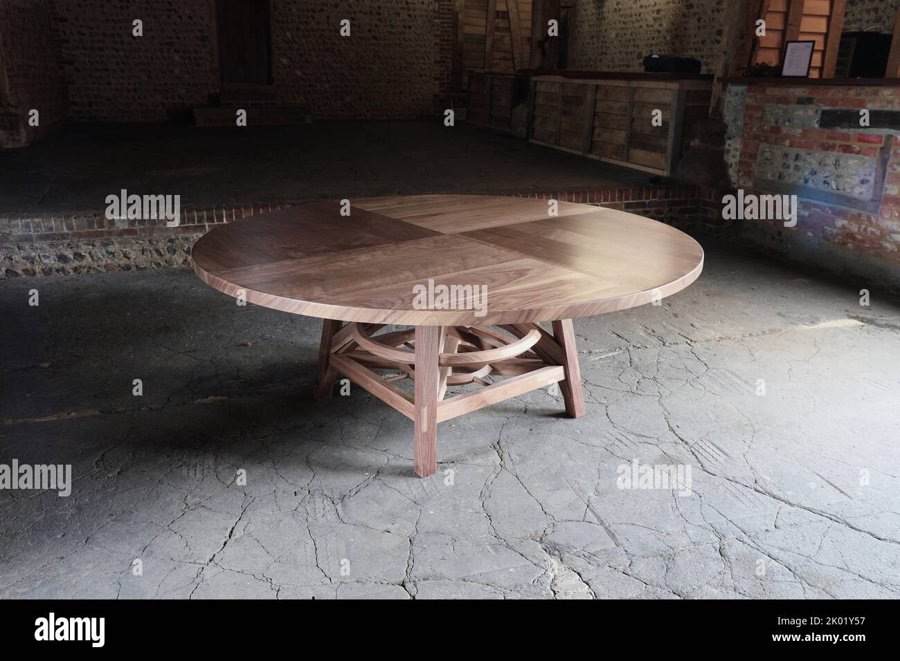 A simple wooden round table design idea Stock Photo - Alamy