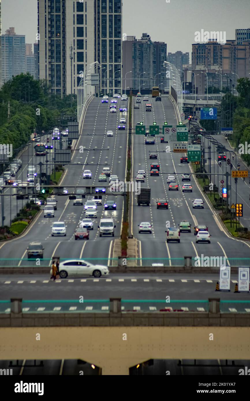 An aerial vertical shot of a highway with many transportations in ...