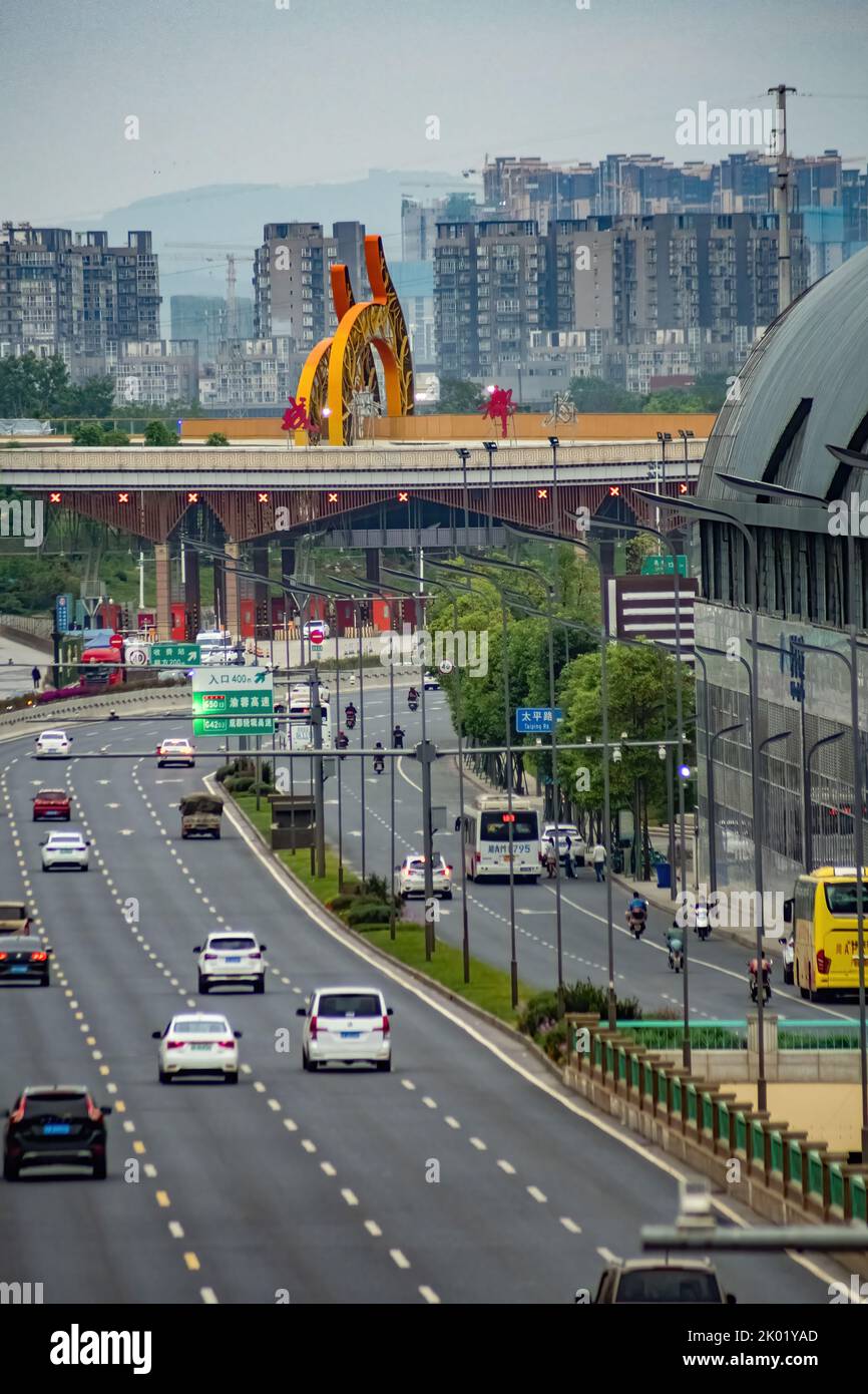 An aerial vertical shot of a highway with many transportations in ...