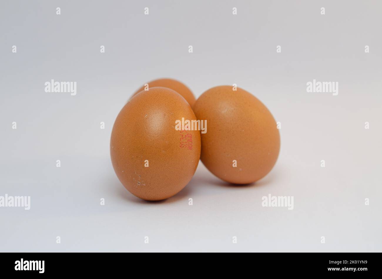 A closeup shot of three eggs isolated on the white background Stock ...