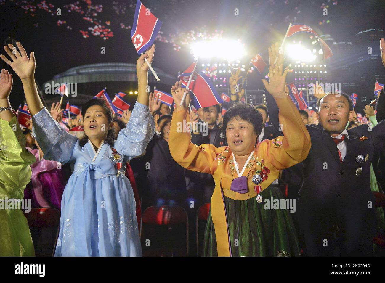 People attend an event in Pyongyang on Sept. 8, 2022, a day before the ...