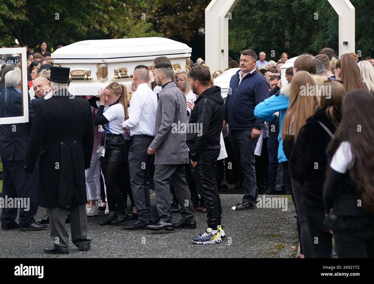 The coffins carrying the remains of Lisa Cash, 18, and her eight-year ...