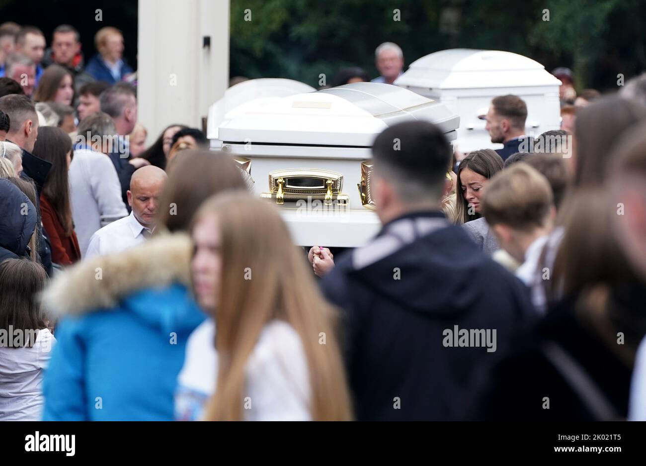 The coffins carrying the remains of Lisa Cash, 18, and her eight-year ...