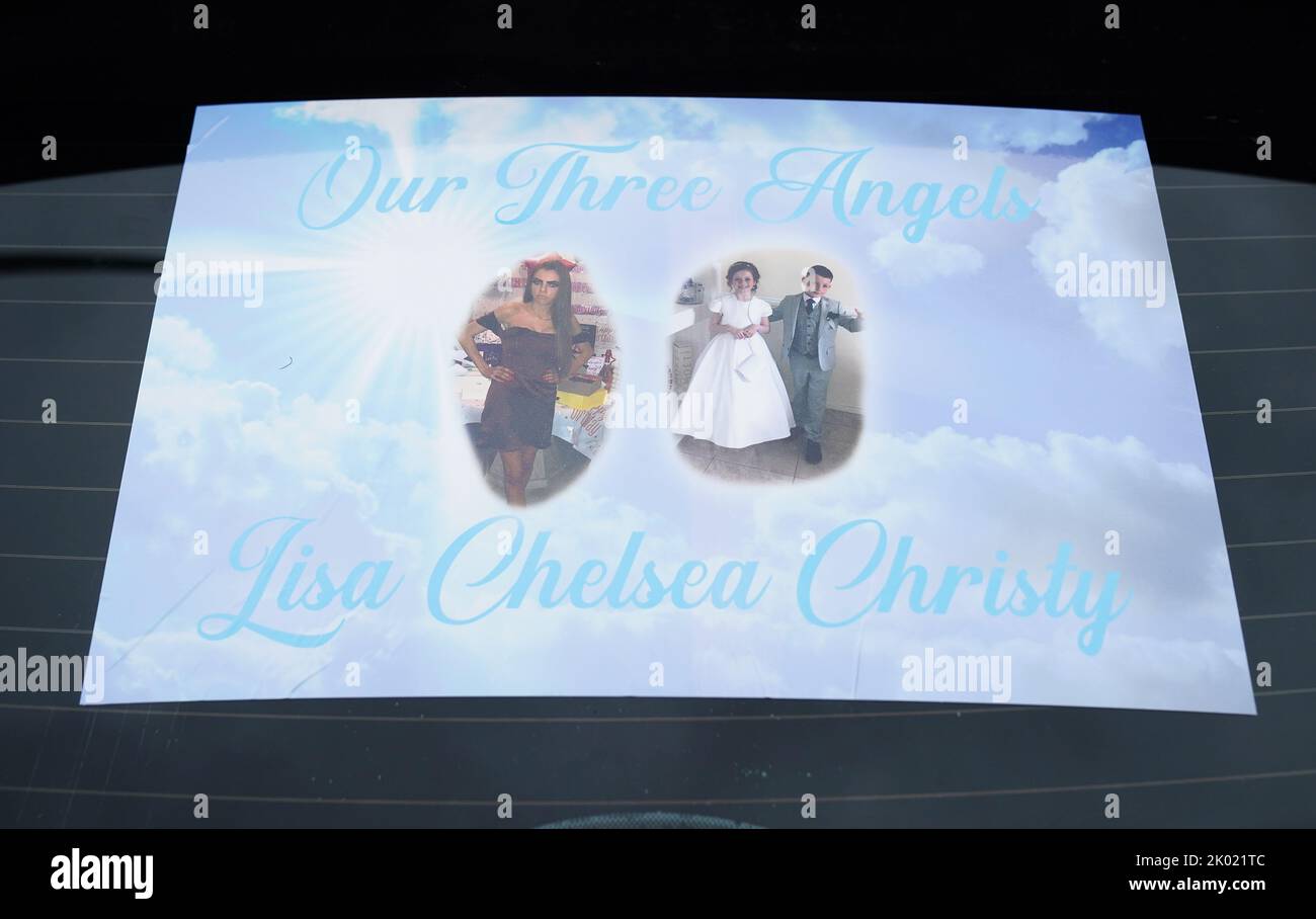 A sticker on the back windscreen of a car as the funeral service of ...