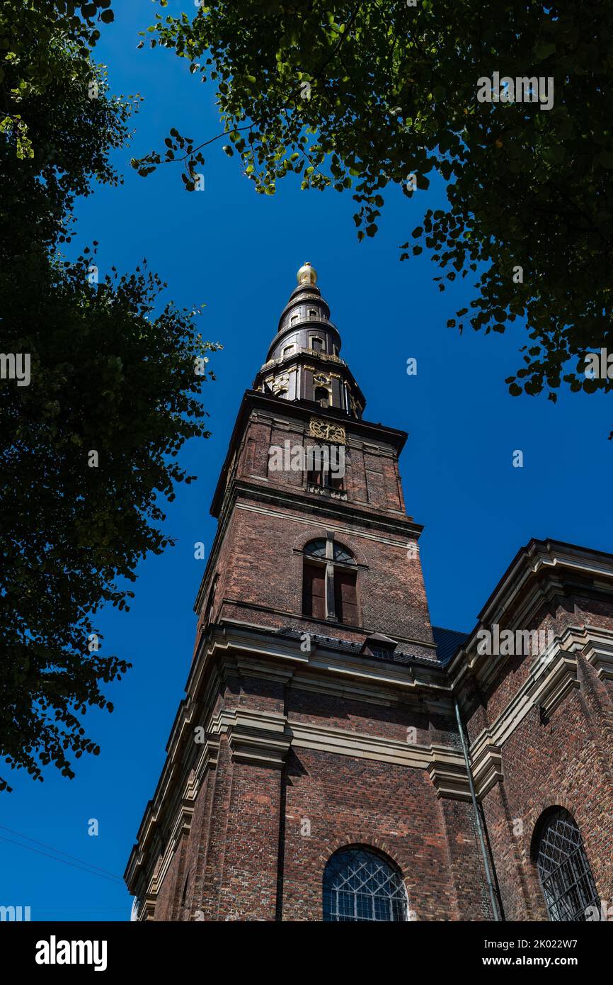 The tower of Church of Our Saviour in Copenhagen, Denmark against the ...