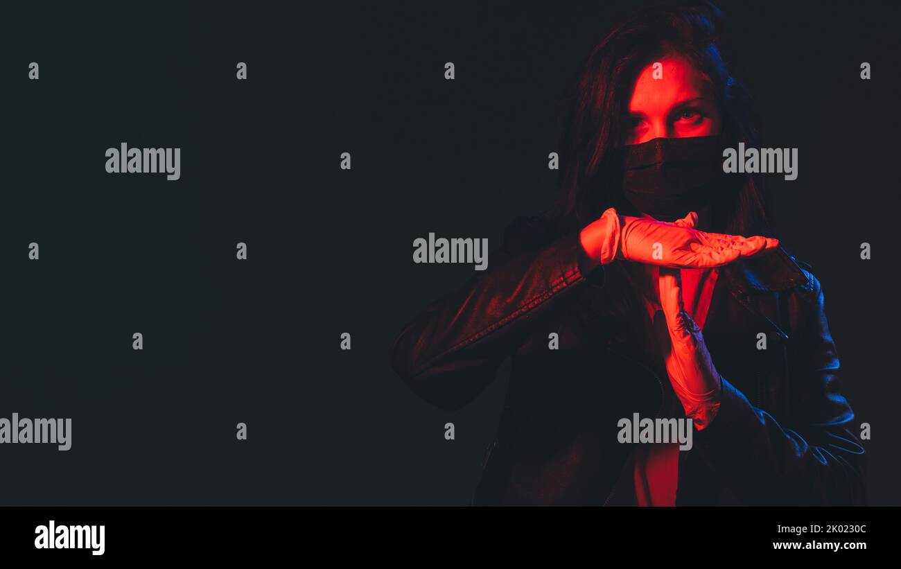time up pandemic restriction woman face mask dark Stock Photo - Alamy