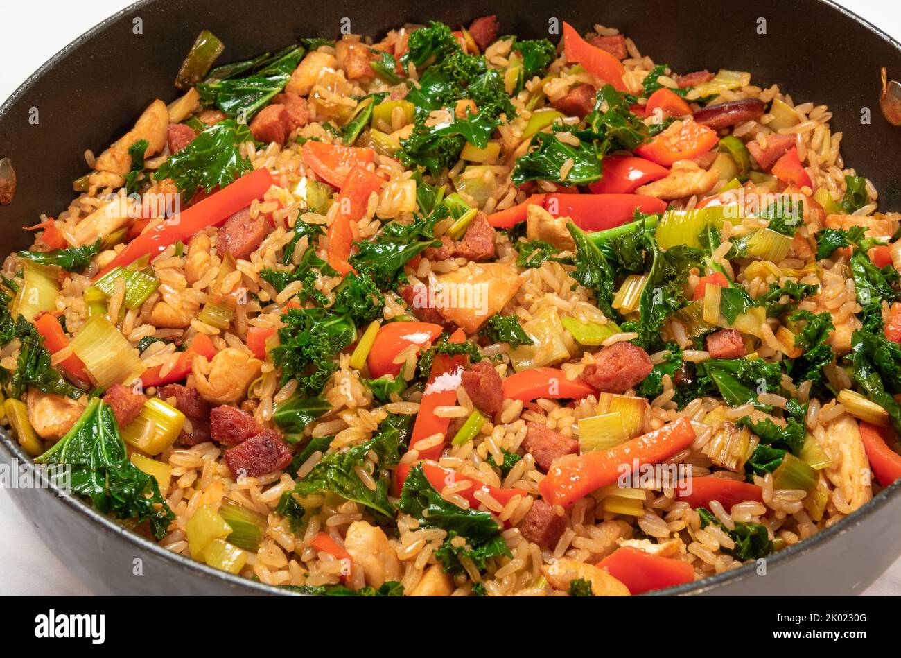 Chicken, leek and brown rice stir-fry Stock Photo - Alamy