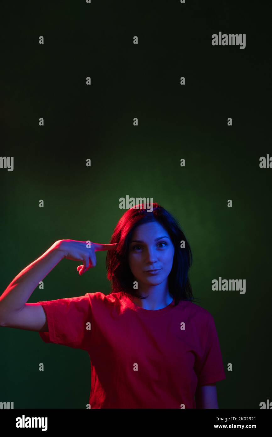 neon light female portrait creative idea think Stock Photo - Alamy
