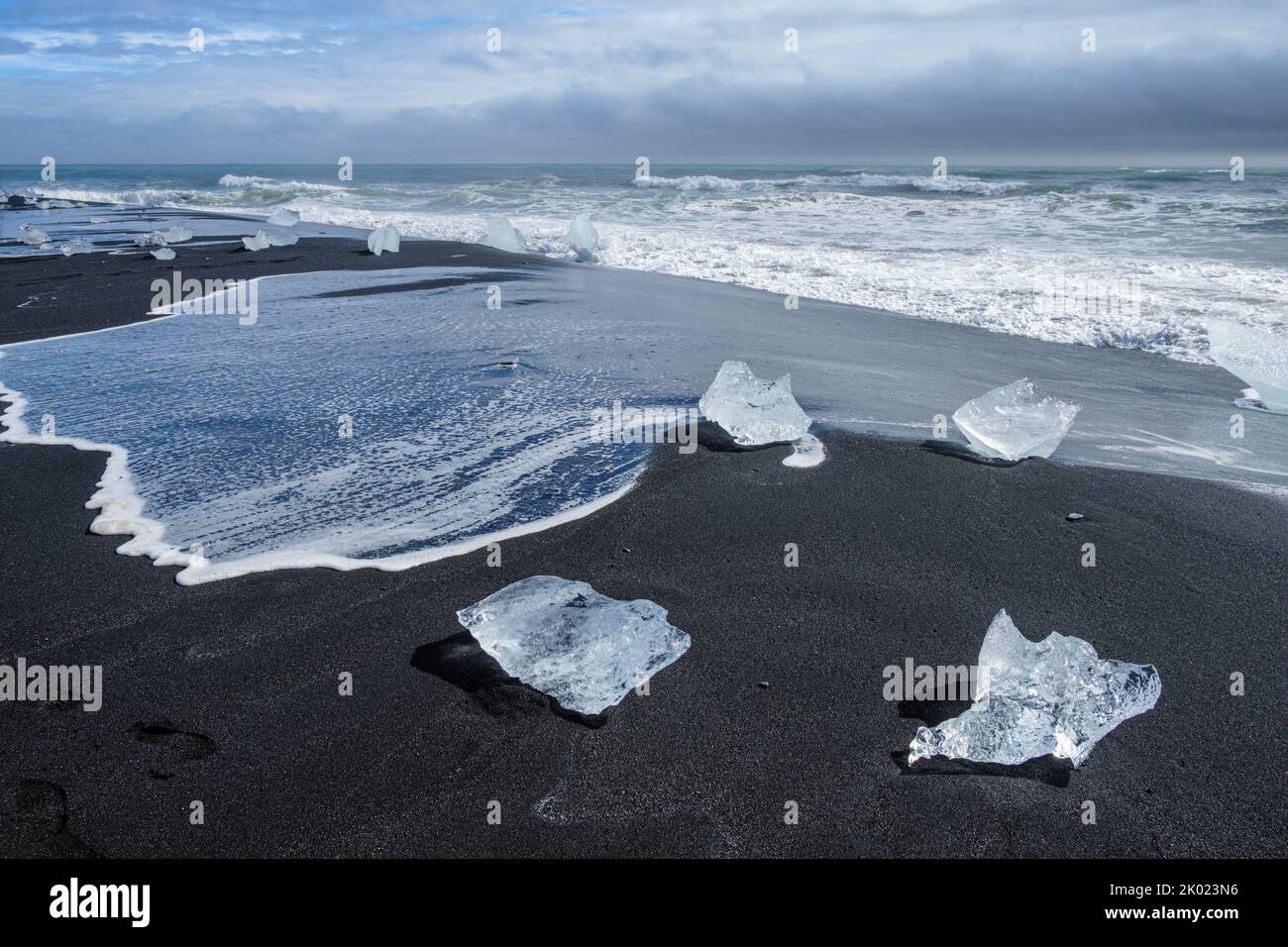 Blocks of ice from the Jokulsarlon glacial lagoon washed up on Diamond ...