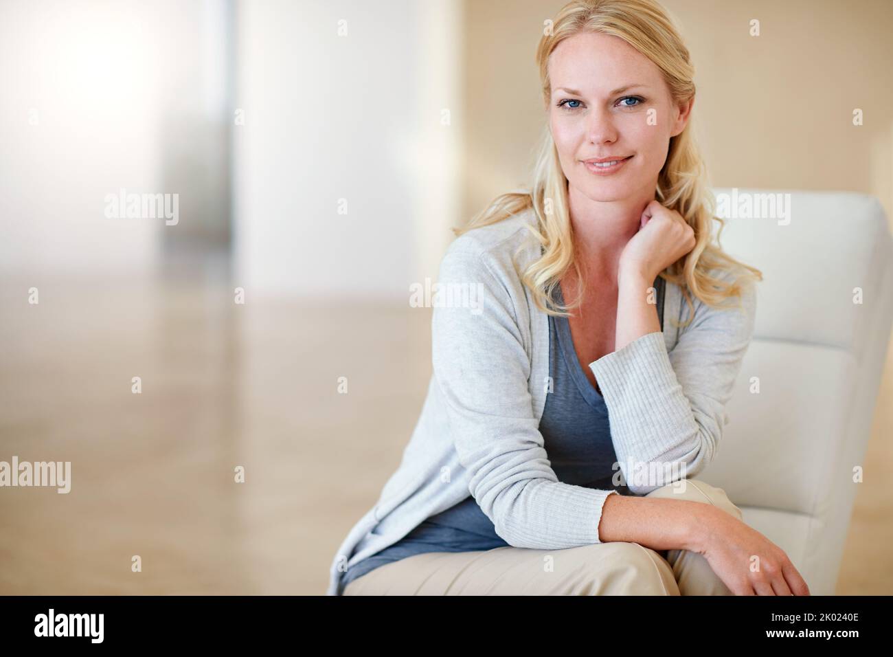 Home is my place to relax. Portrait of a woman relaxing in her living ...