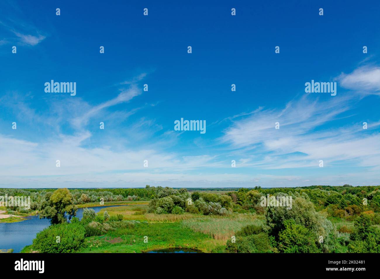 A beautiful landscape: a view of a green valley and a river, a ...