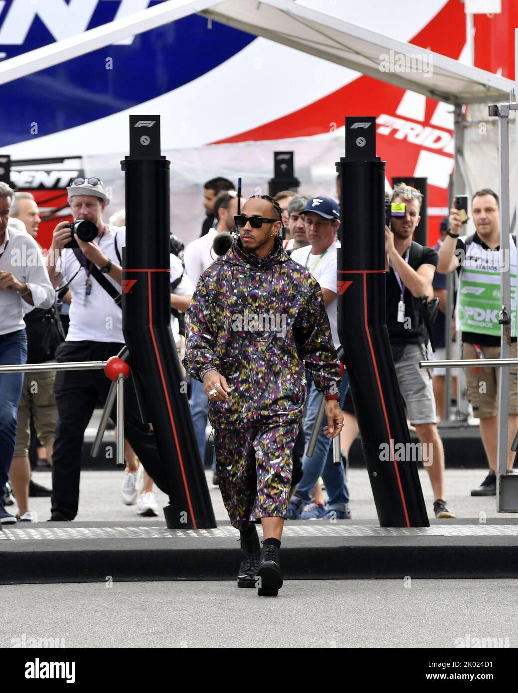 Lewis Hamilton of Great Britain and Mercedes walks in the Paddock prior ...