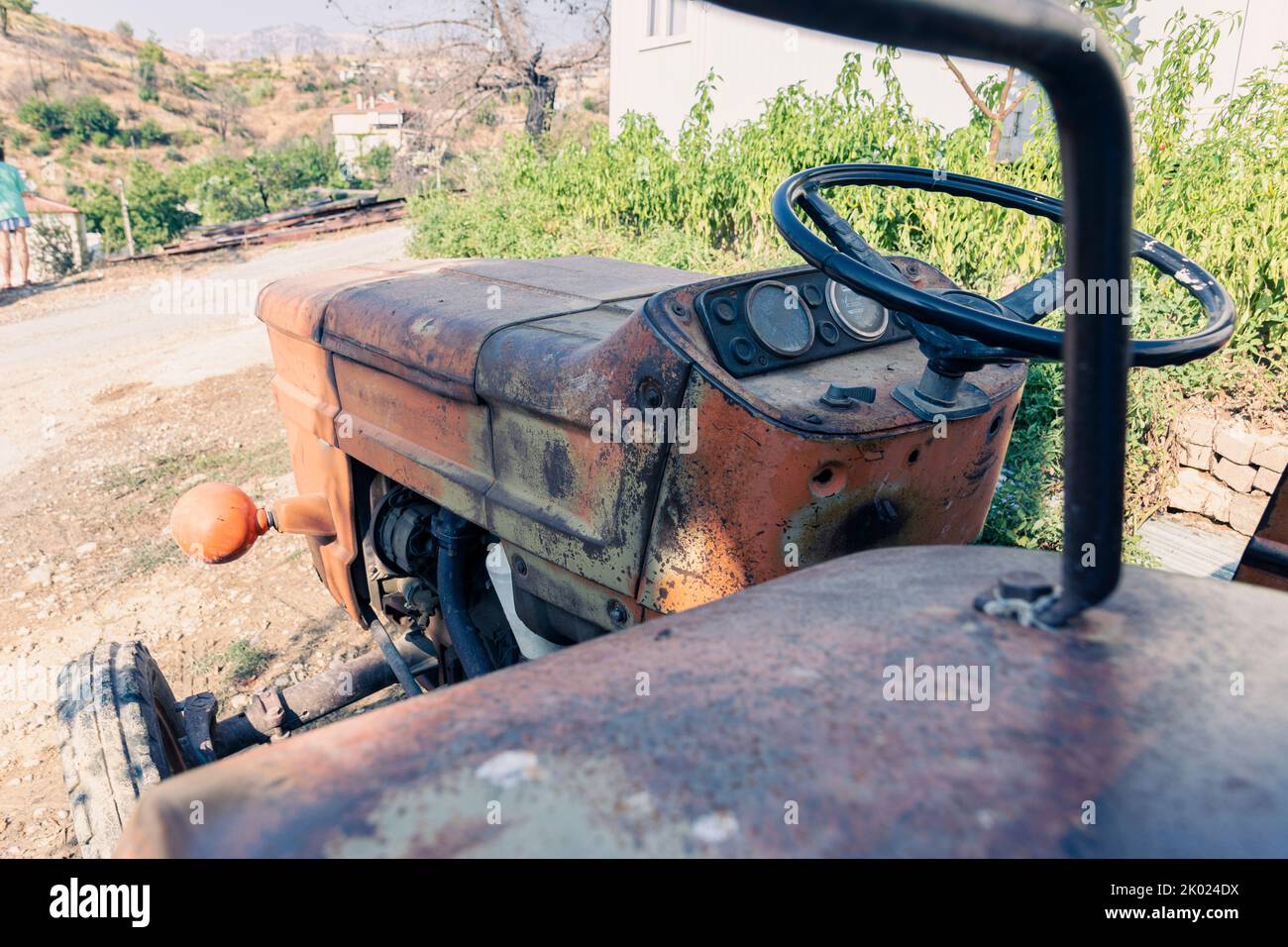 Old red vintage tractor with an open cab. photo of a rural tractor ...