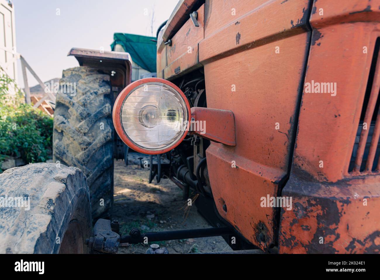 Old red vintage tractor with an open cab. photo of a rural tractor ...