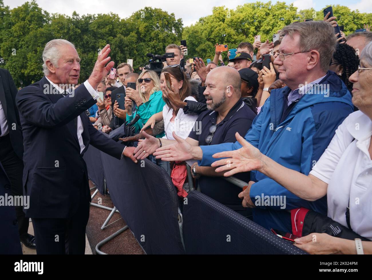 King Charles III is greeted by well-wishers during a walkabout to view ...