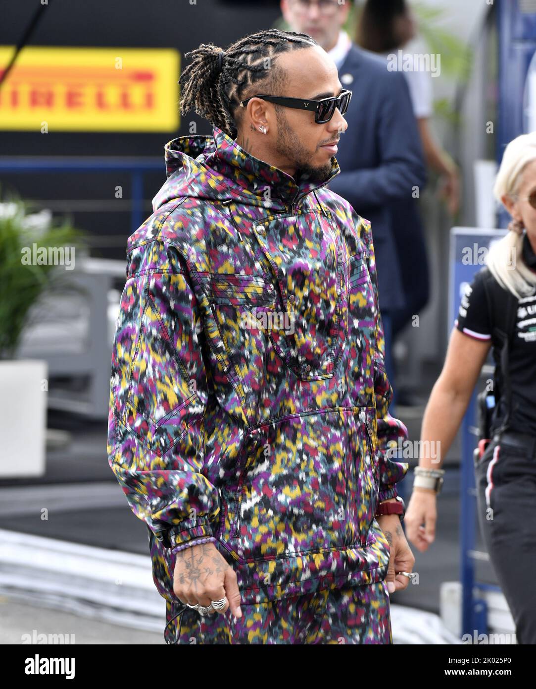 Lewis Hamilton of Great Britain and Mercedes walks in the Paddock prior ...