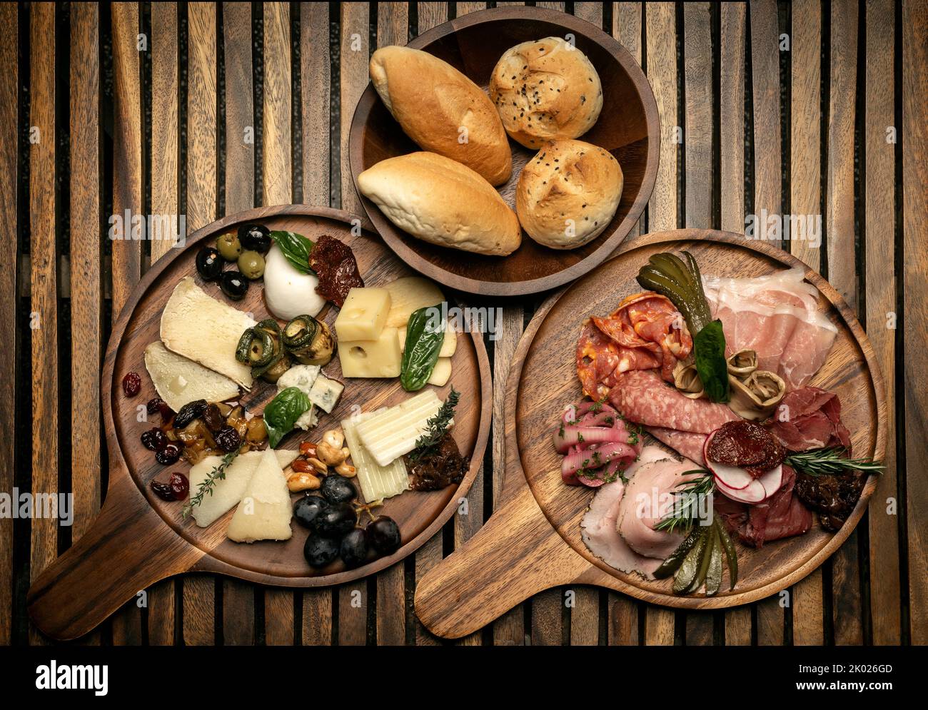 mixed european charcuterie and cheese cold cuts platter on wood table ...
