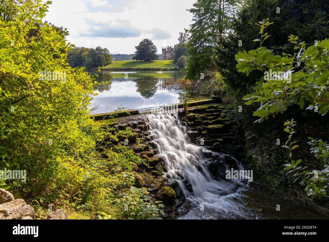 The waterfall at the outlet of the artificial lake in the grounds of ...