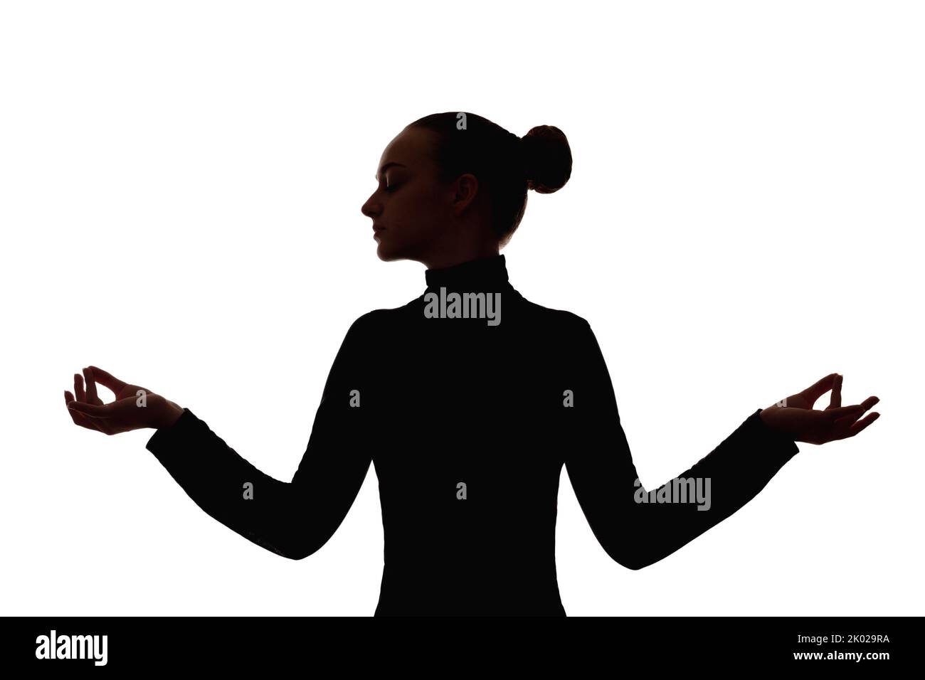 female silhouette meditation practice soul healing Stock Photo - Alamy