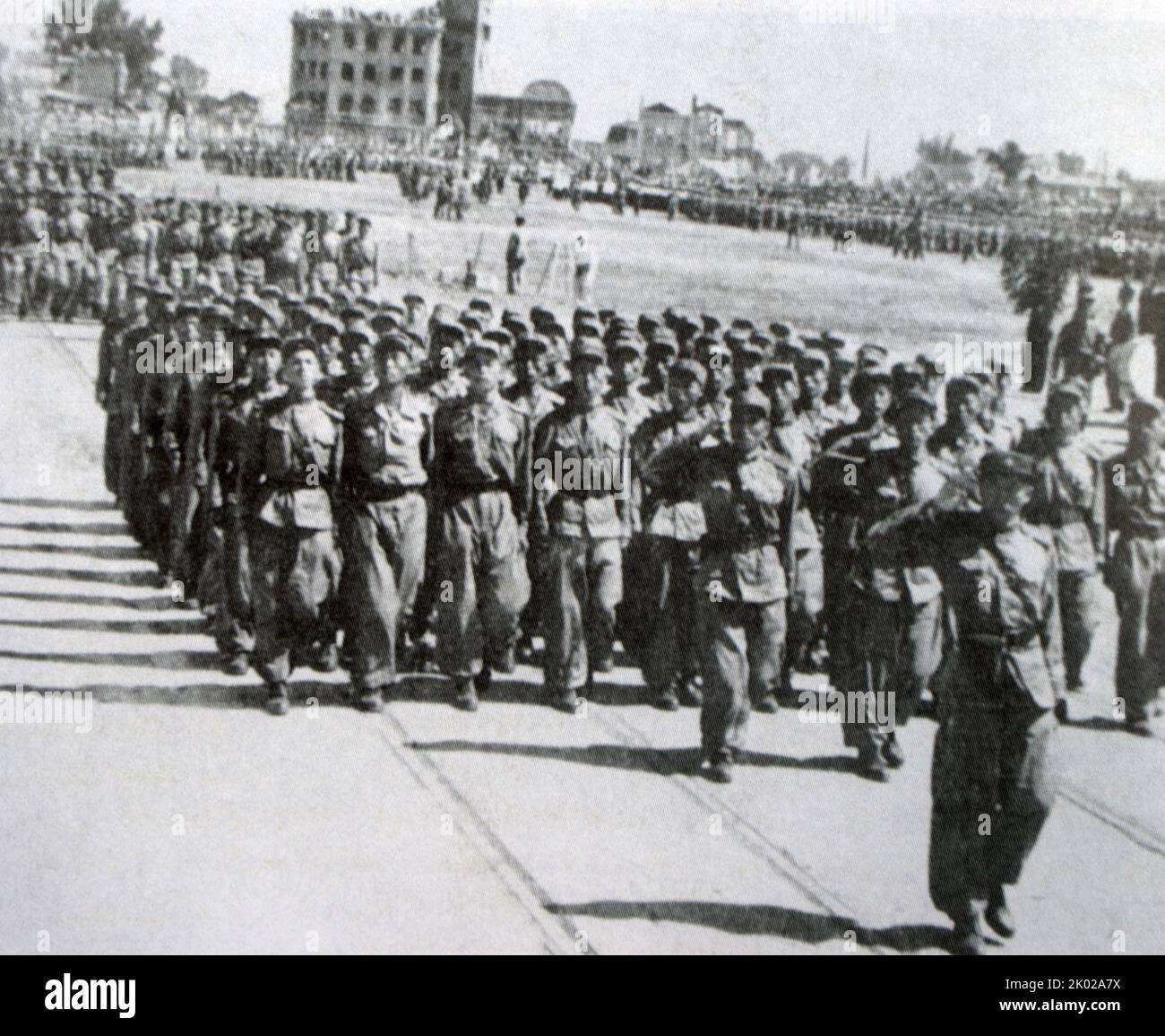 Marshal Kim Il Sung receives a military parade after the end of the war ...