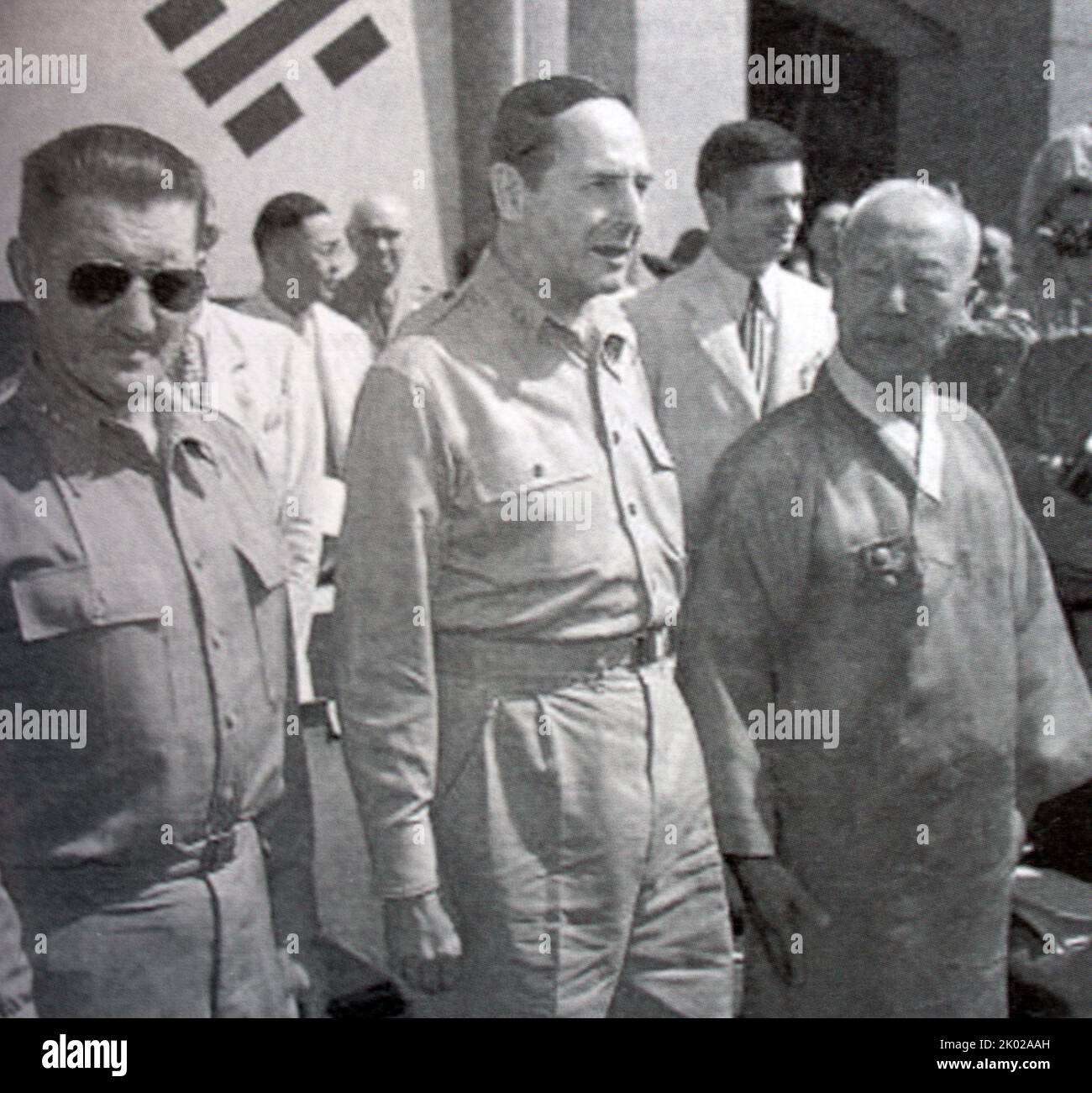 South Korean President Syngman Rhee (R), Gen. Douglas MacArthur (C) and ...