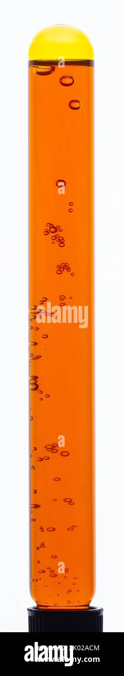 Yellow viscous liquid sunflower lecithin with bubbles in a transparent ...