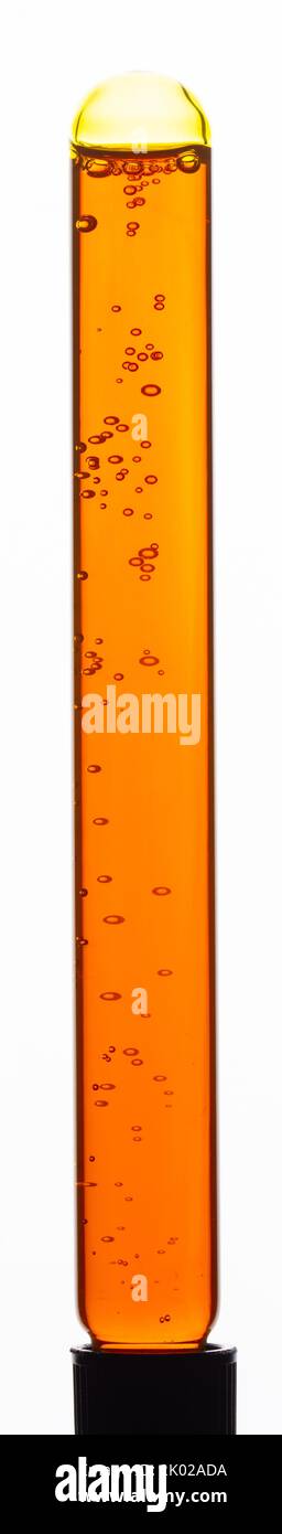 Yellow viscous liquid sunflower lecithin with bubbles in a transparent ...