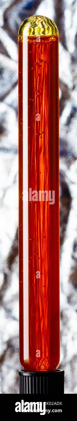 Yellow viscous liquid sunflower lecithin with bubbles in a transparent ...