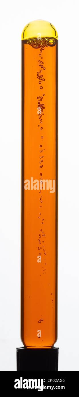 Yellow viscous liquid sunflower lecithin with bubbles in a transparent ...