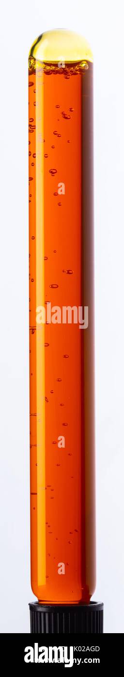 Yellow viscous liquid sunflower lecithin with bubbles in a transparent ...