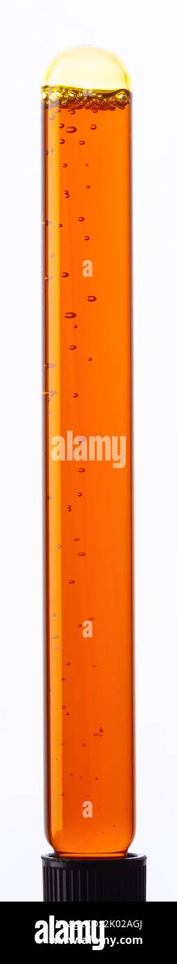 Yellow viscous liquid sunflower lecithin with bubbles in a transparent ...