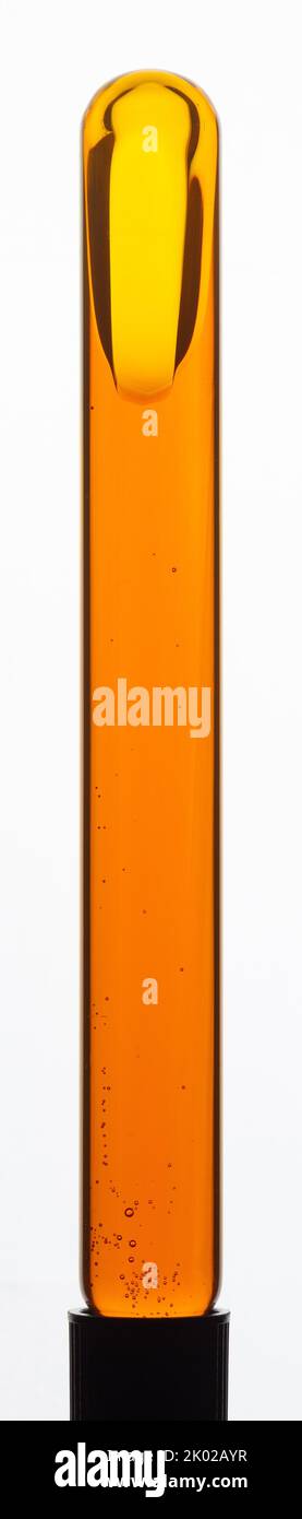 Yellow viscous liquid sunflower lecithin with bubbles in a transparent ...