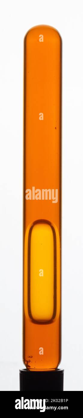 Yellow viscous liquid sunflower lecithin with bubbles in a transparent ...