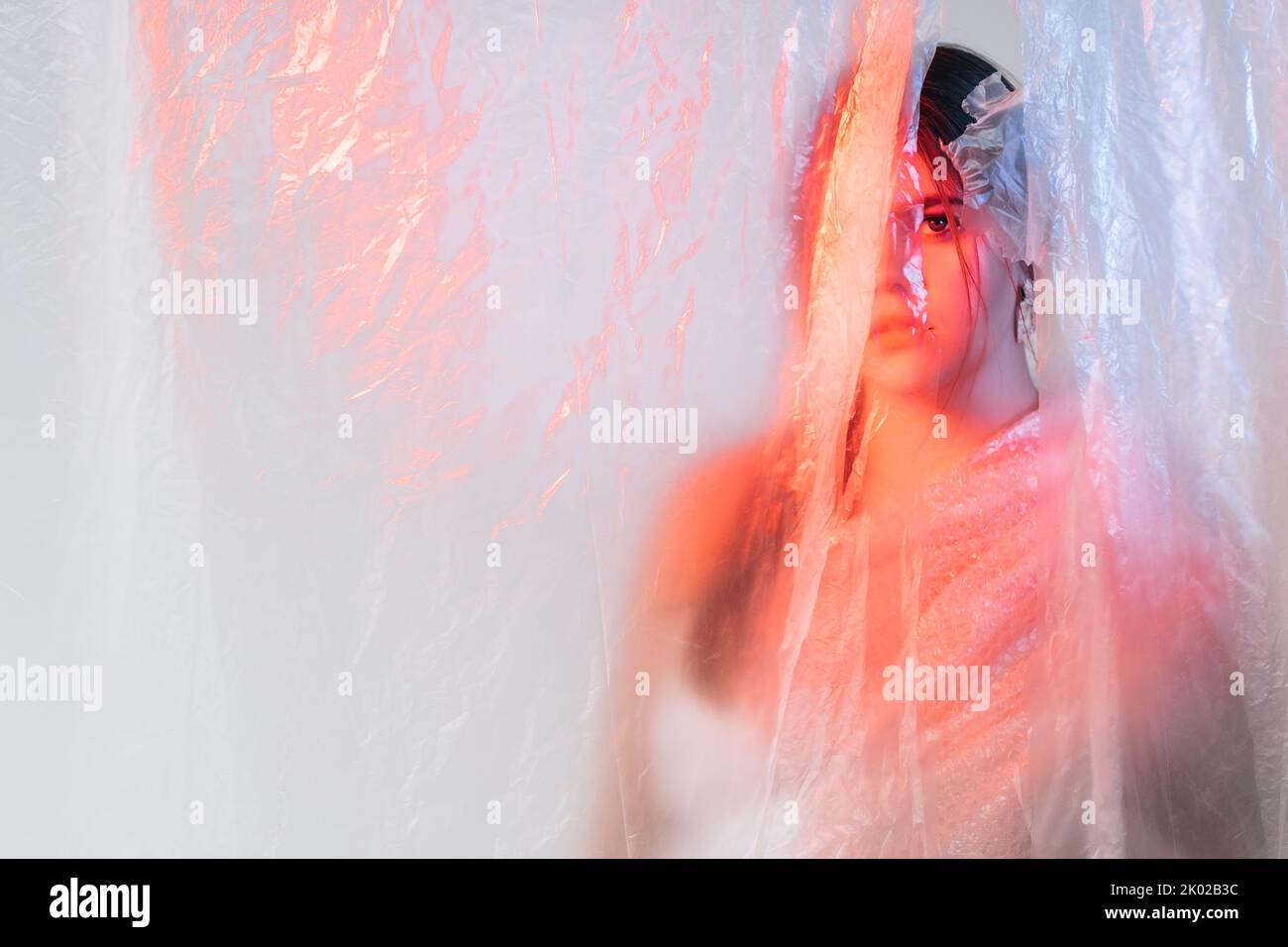 covid-19 self isolation disturbed woman neon light Stock Photo - Alamy