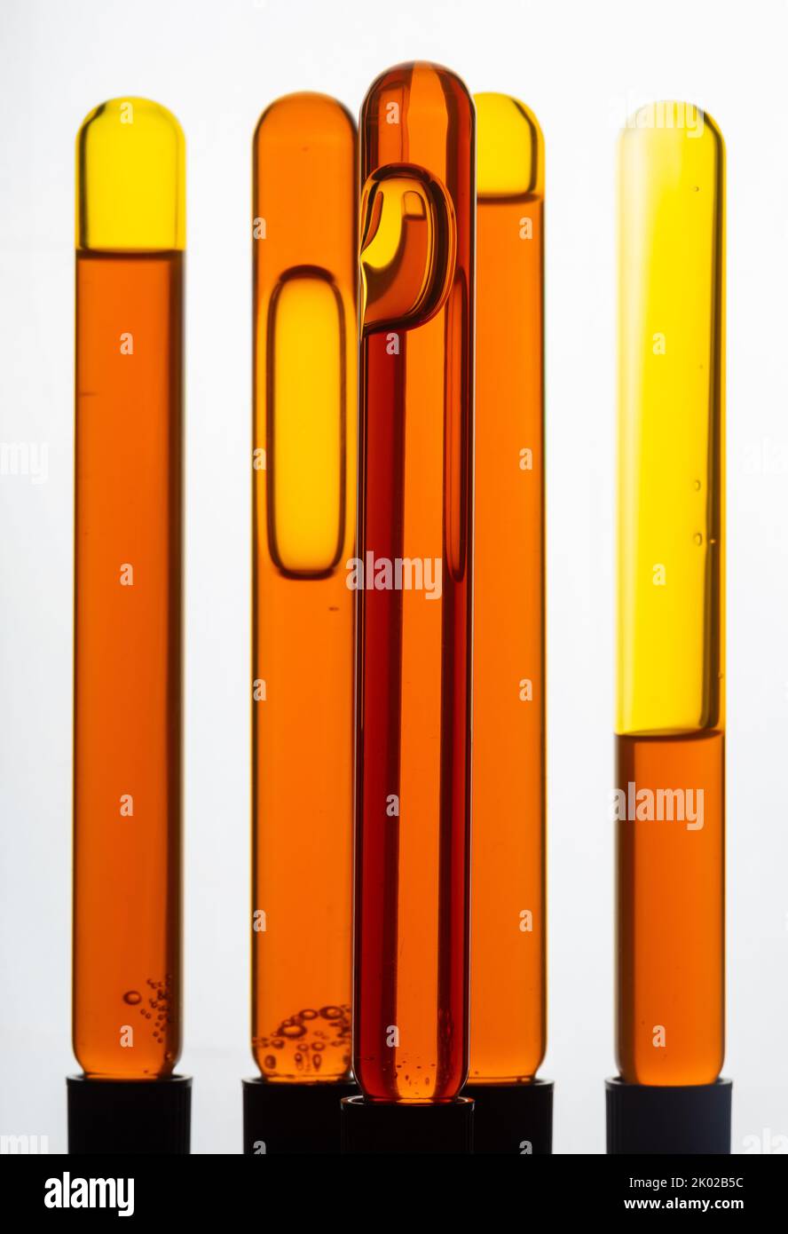 Yellow viscous liquid sunflower lecithin with bubbles in a transparent ...