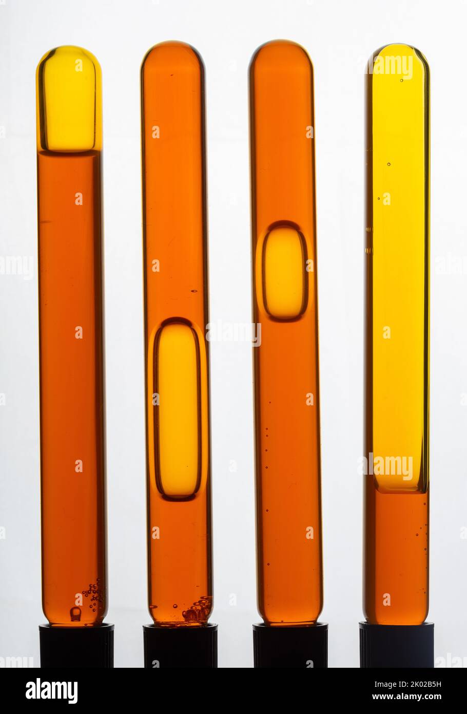 Yellow viscous liquid sunflower lecithin with bubbles in a transparent ...